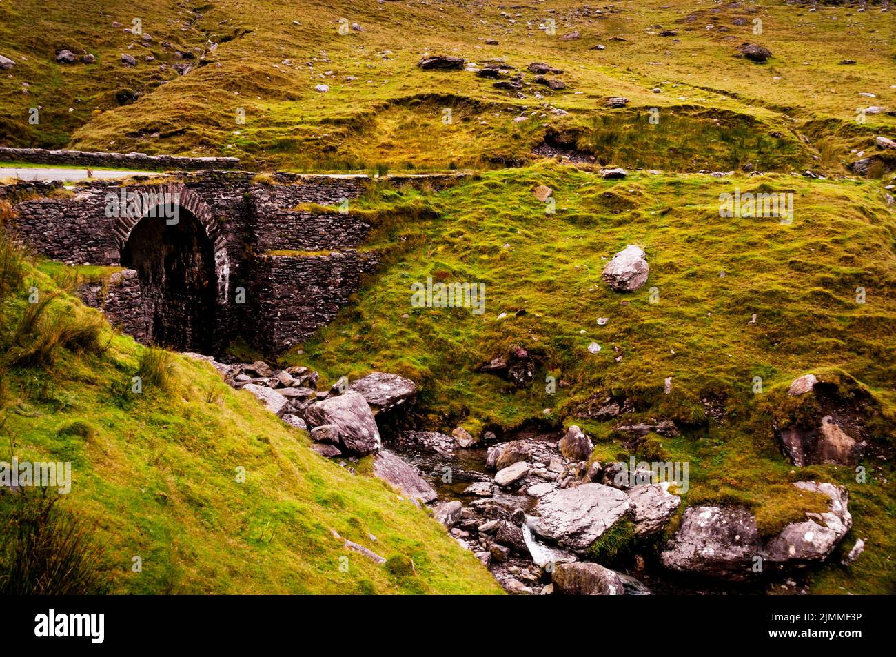 Arched stone bridge on the road to the Gap of Dunloe, Ring of Beara in ...