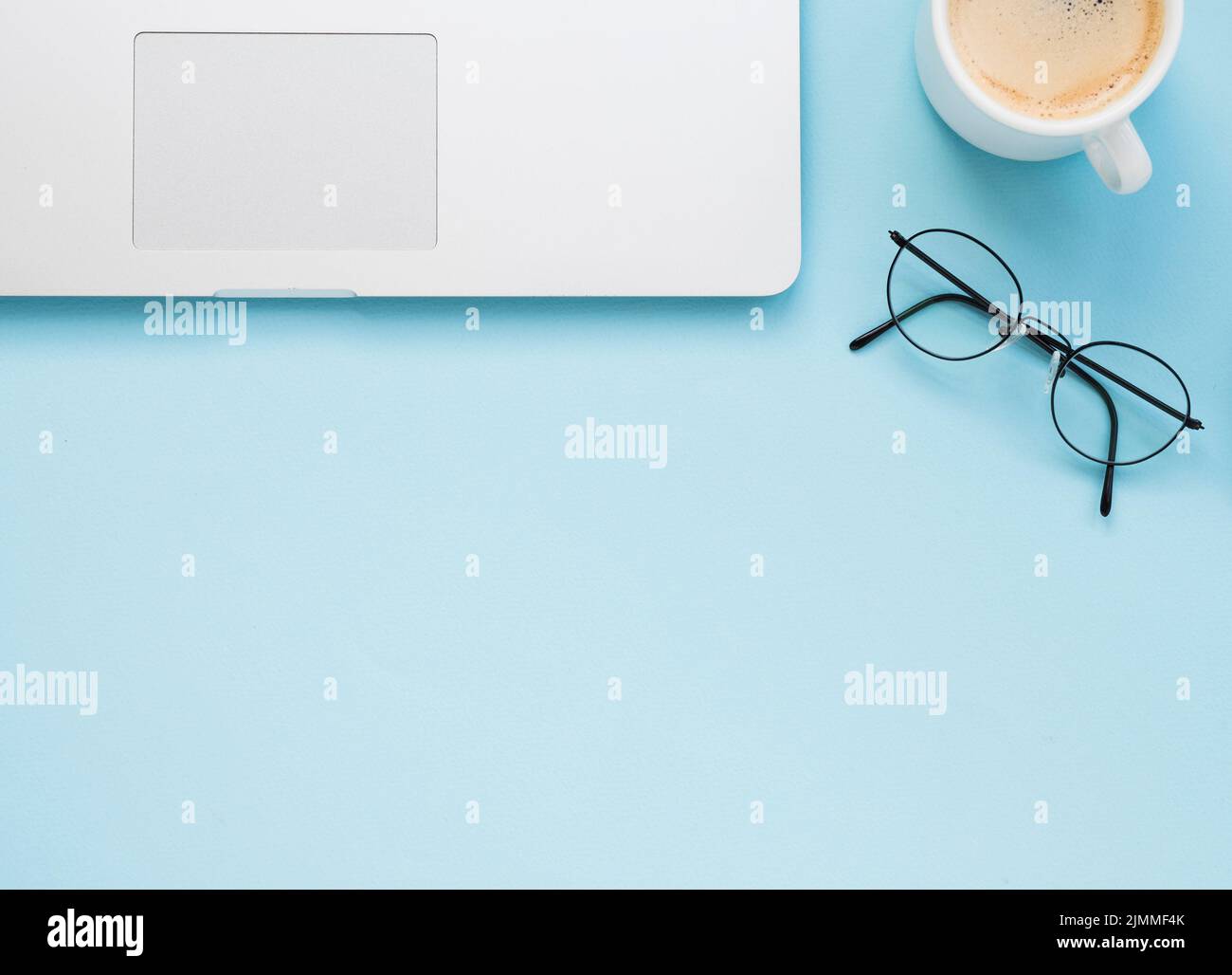 Flat lay clean office desk with blue background Stock Photo - Alamy