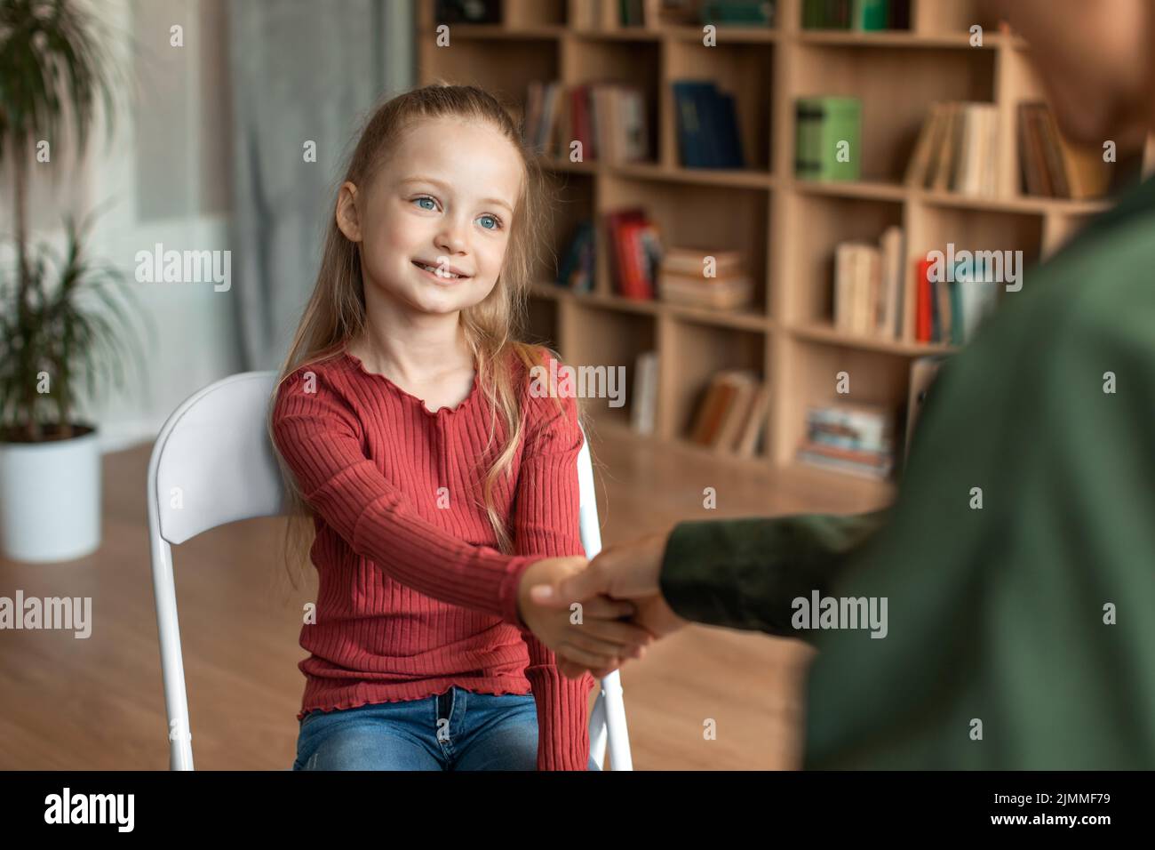 Pretty preschooler girl visiting psychotherapist, woman and child ...