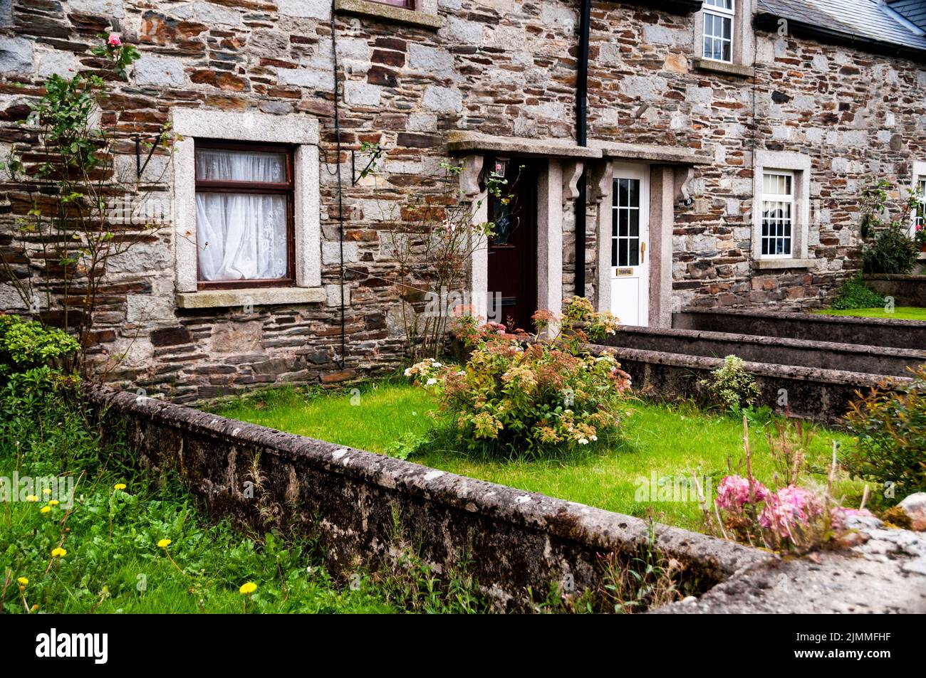 Terraced cottages with stone door pediments in Hacketstown in County ...