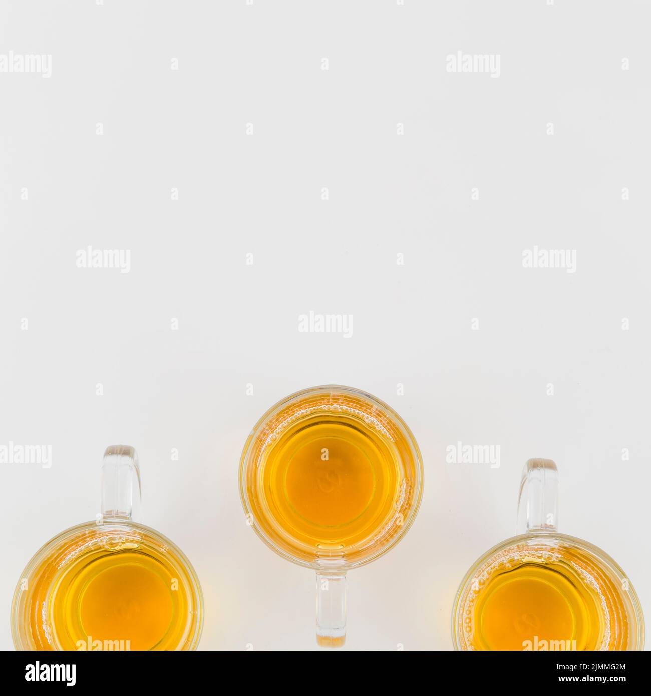 Green herbal glass tea cups white background Stock Photo - Alamy