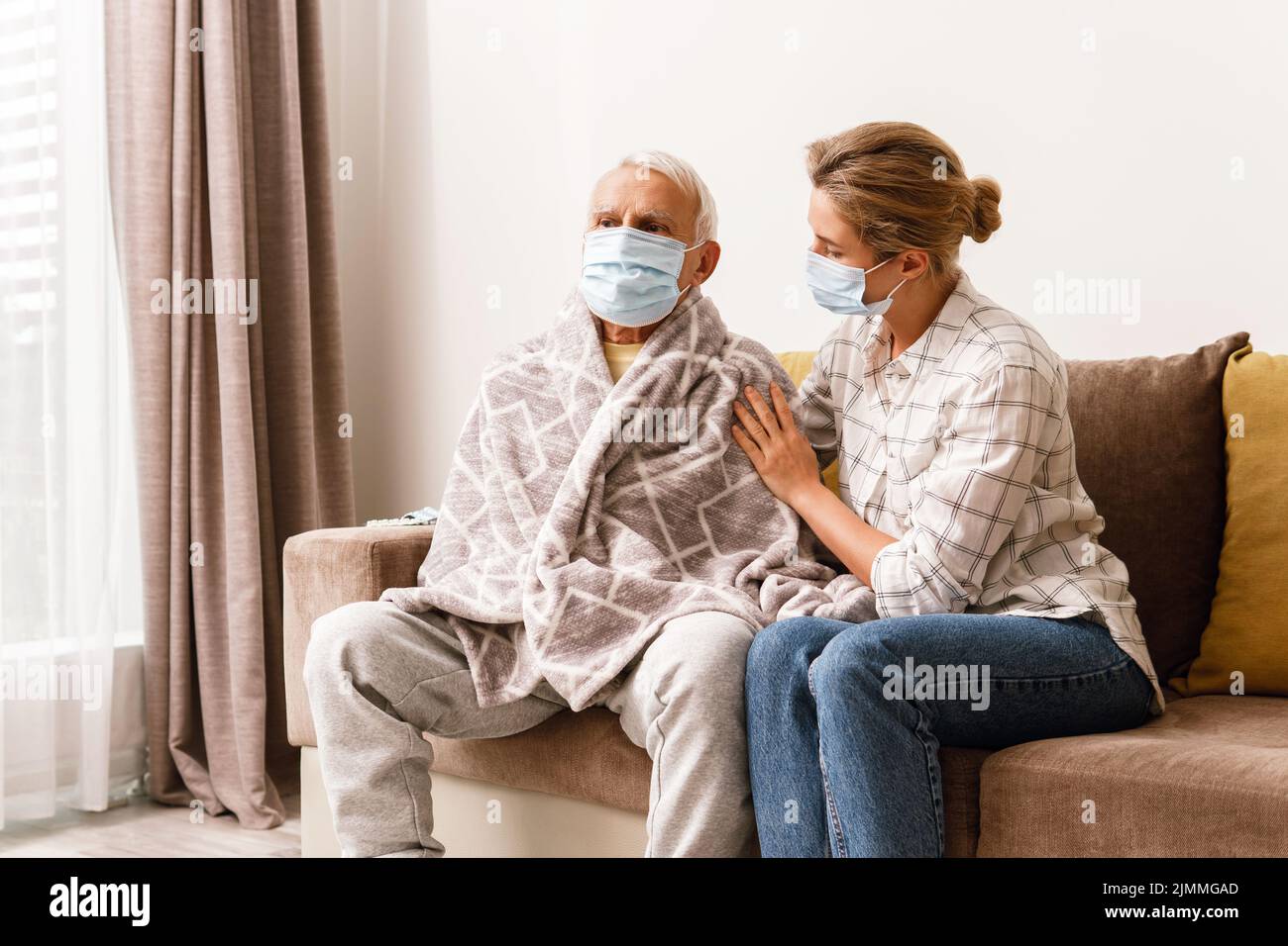 Woman taking care of her elderly grandfather with a cold syptoms Stock ...