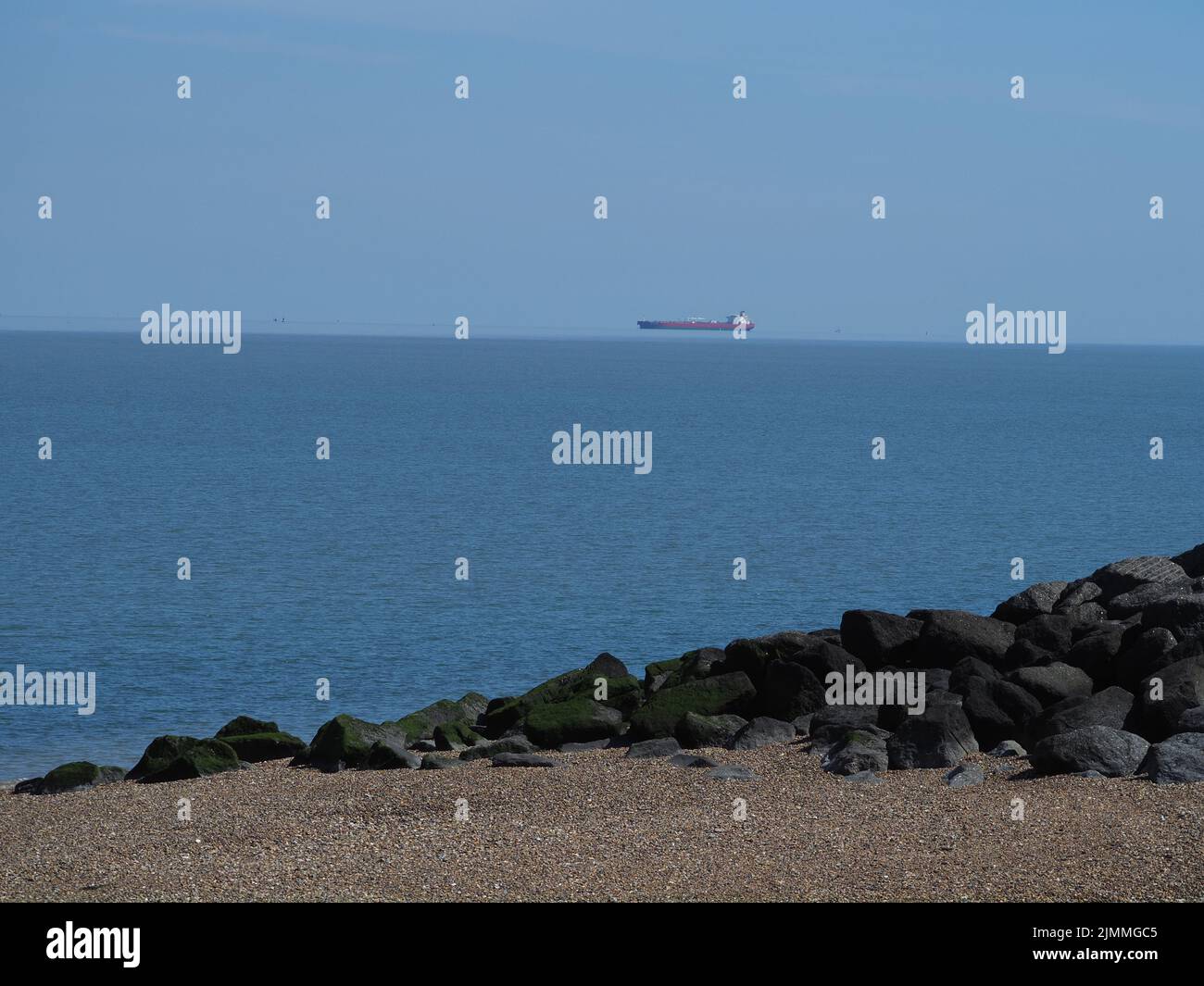 Sheerness, Kent, UK. 7th Aug, 2022. UK Weather: a ship appears to ...