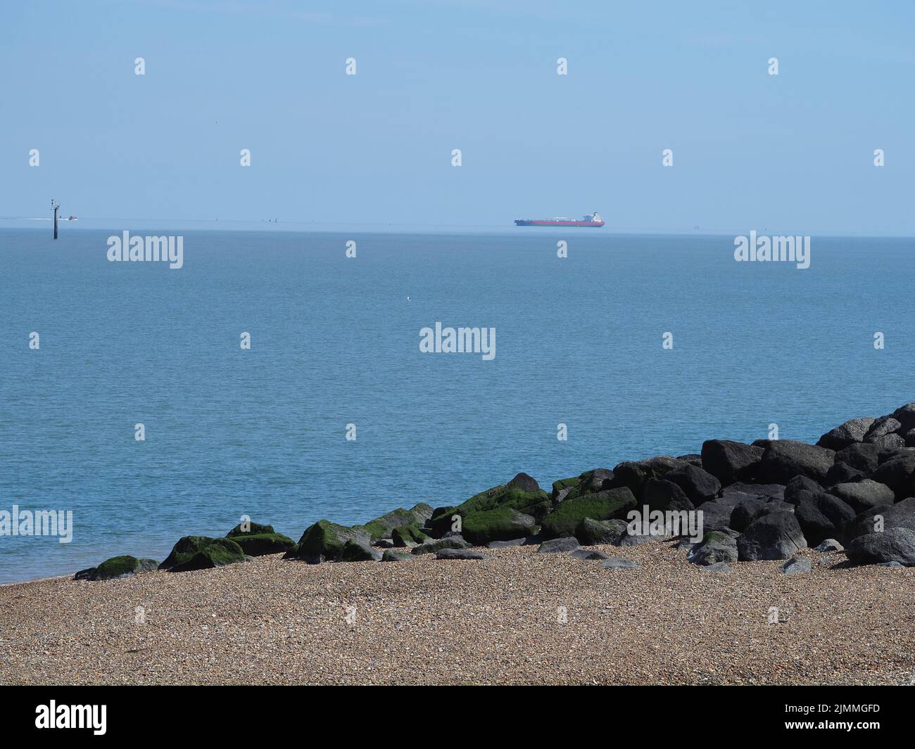 Sheerness, Kent, UK. 7th Aug, 2022. UK Weather: a ship appears to ...