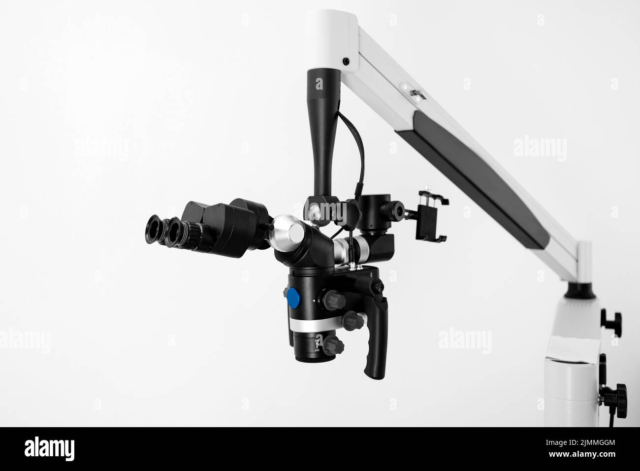 Modern microscope in a dental office photographed on a white background ...
