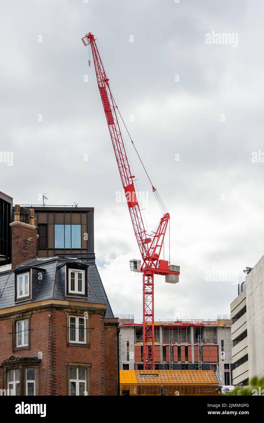 Modern city centre construction urban regeneration work. Big crane with ...