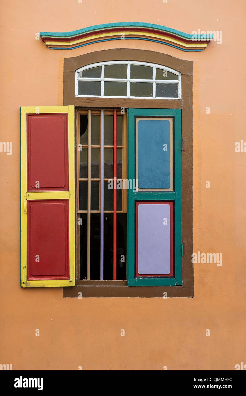 Colorful wooden abstract window, close up . Colonial style architecture ...
