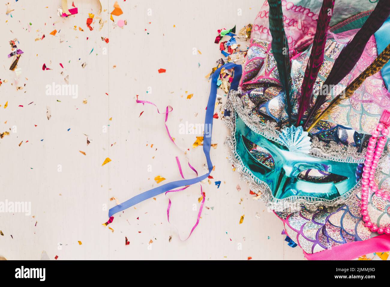 Bright costume with mask confetti Stock Photo - Alamy