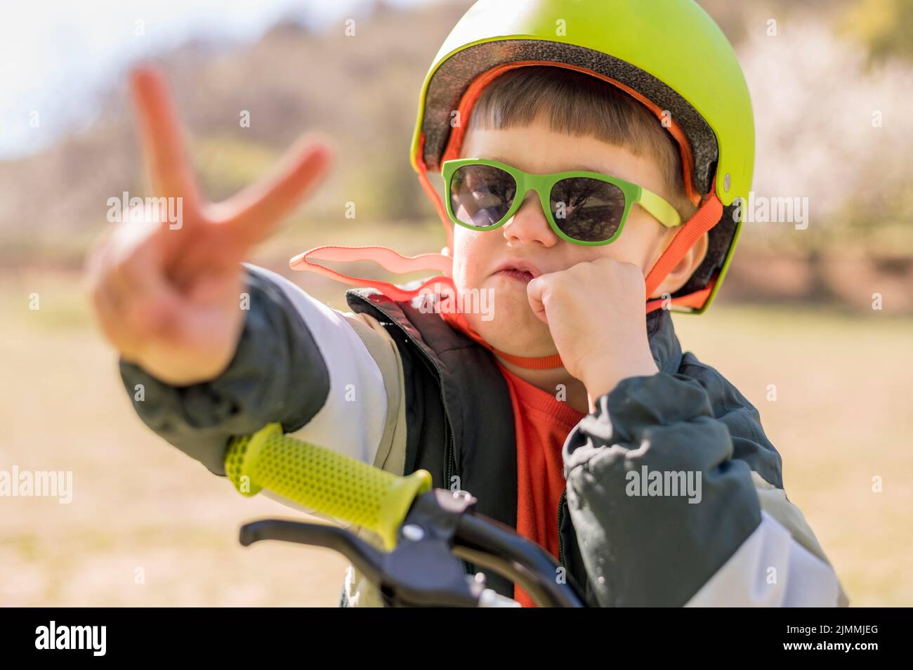Portrait boy riding bicycle Stock Photo - Alamy