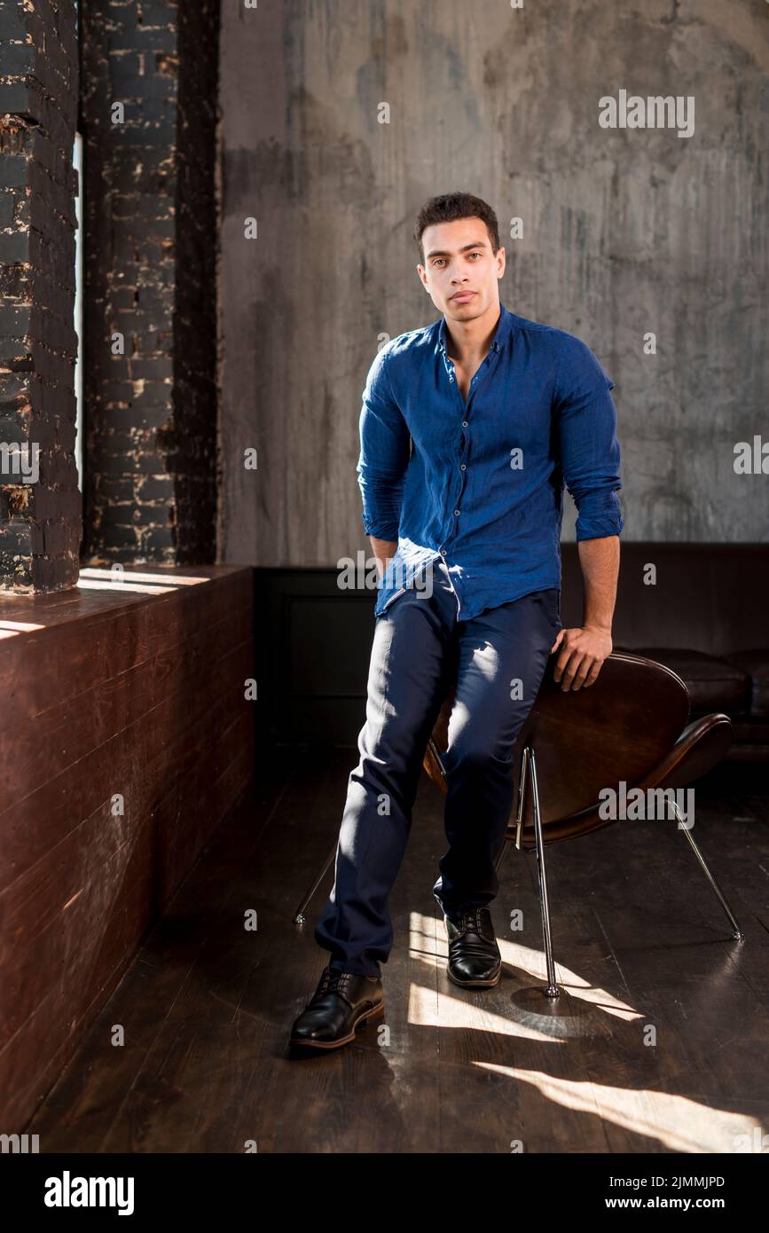 Man sitting chair suit full portrait hi-res stock photography and ...