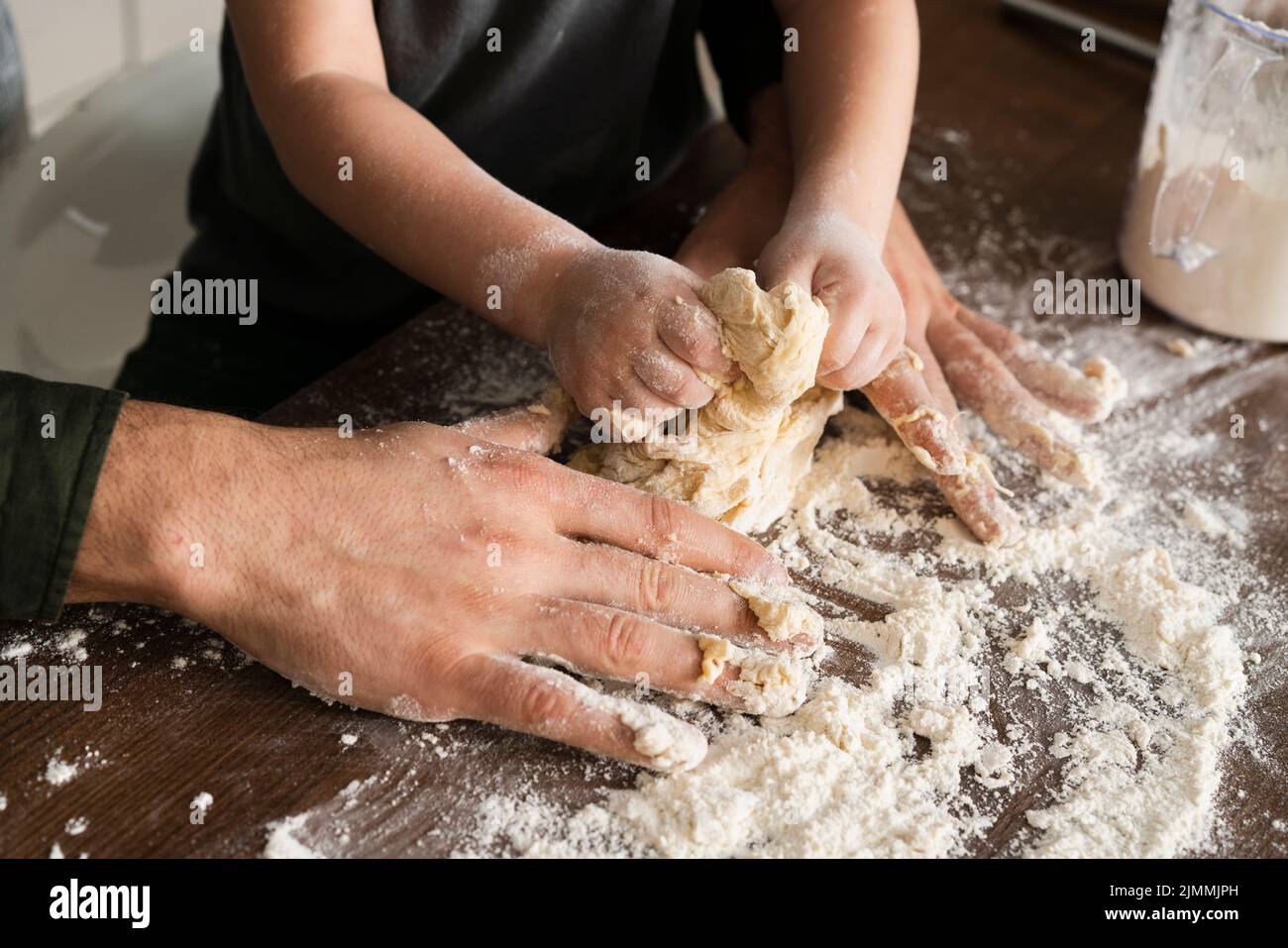 High angle father son making dough Stock Photo - Alamy