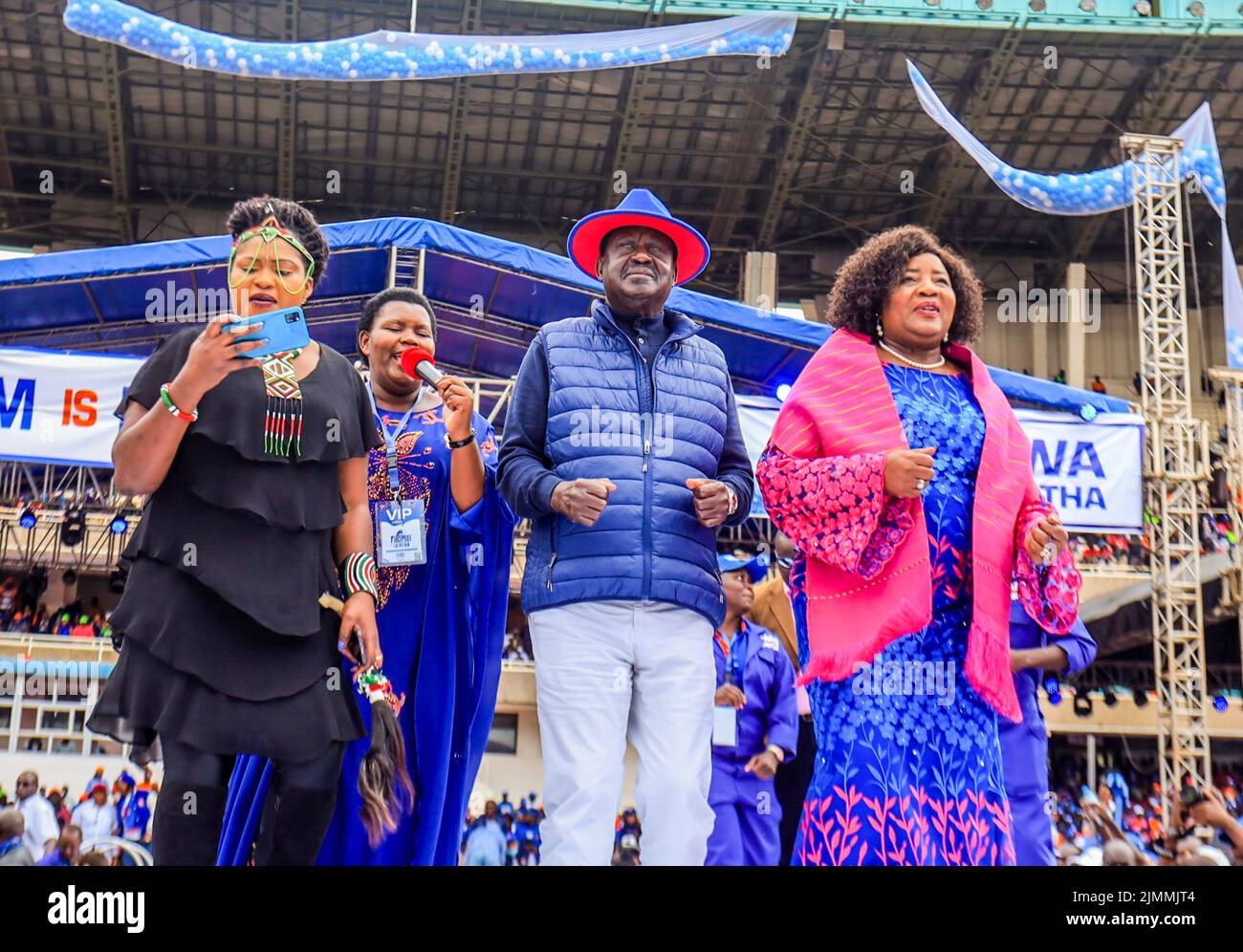 The Azimio la Umoja One Kenya flag bearer Raila Odinga (C) and his wife ...