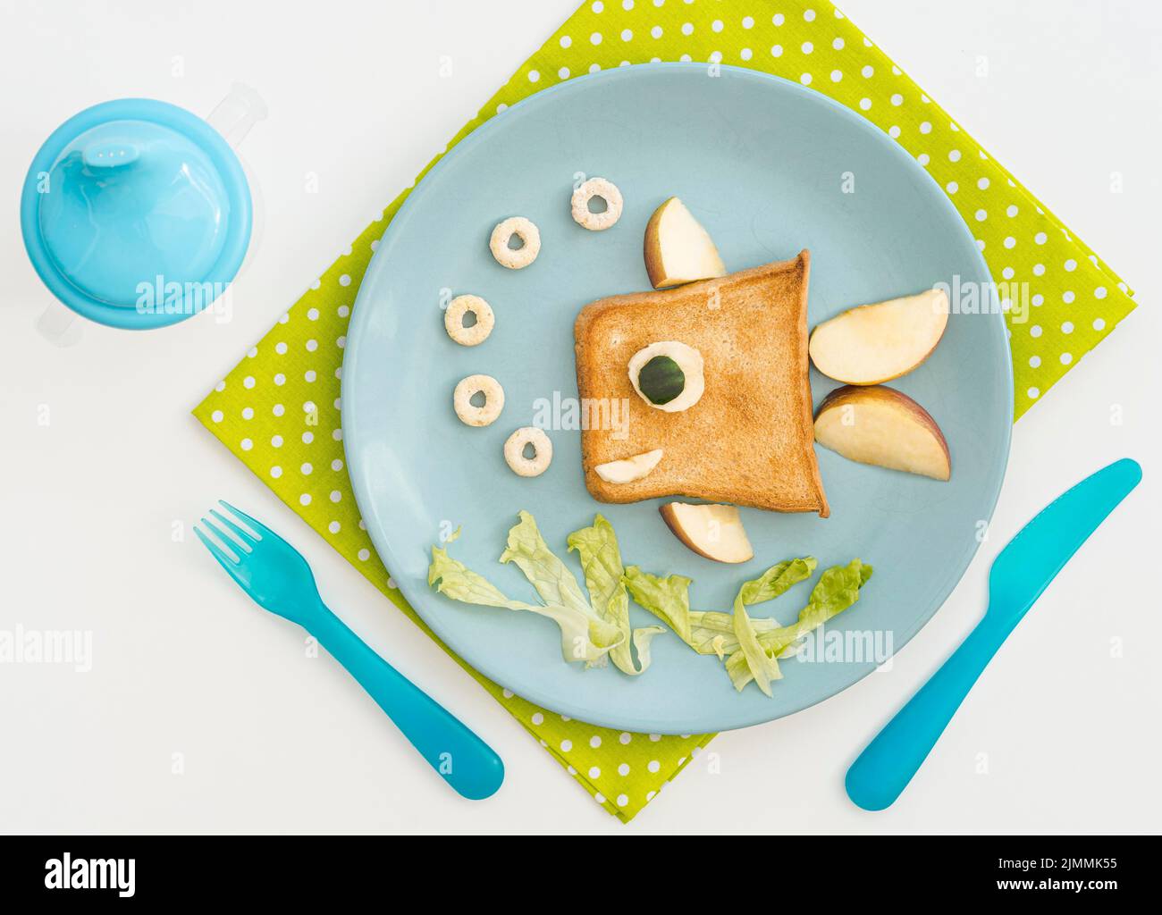 Plate with toast fish shape with apple Stock Photo - Alamy