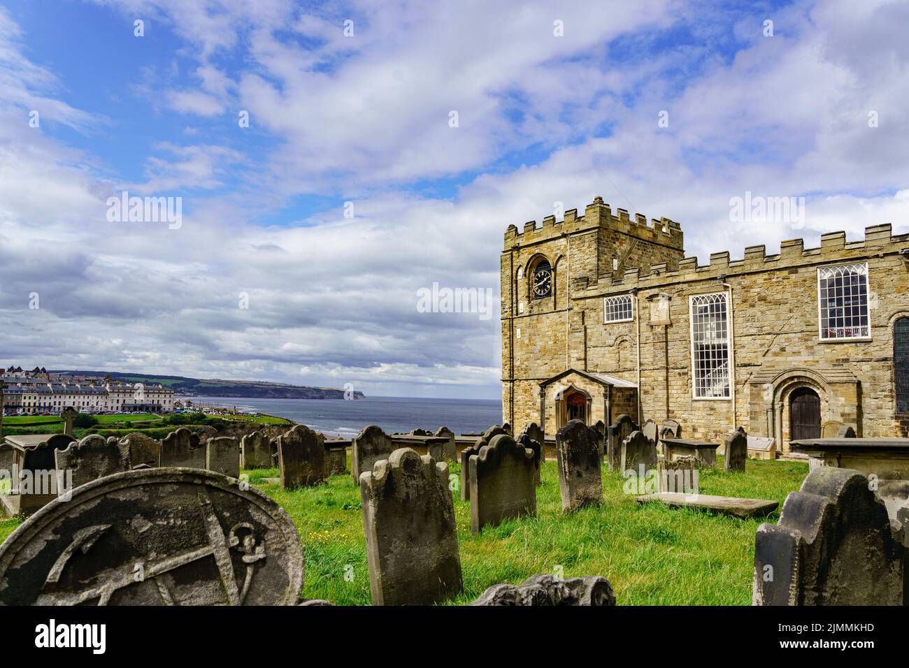 Whitby Church of Saint Mary, with its cemetery, headstones, and sea in ...