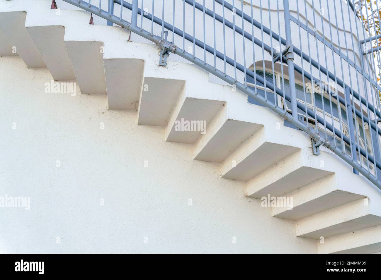 Low angle view of a curved staircase with iron railings in San ...