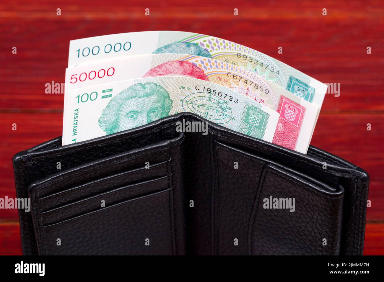 Old Croatian money - dinar in the black wallet Stock Photo - Alamy