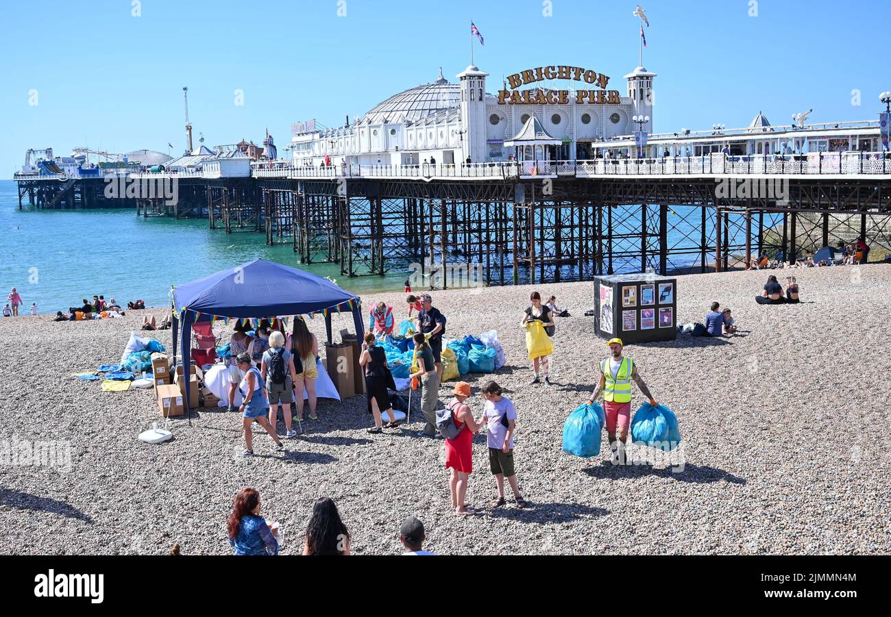 Brighton UK 7th August 2022 - A small army of volunteers help clean up ...