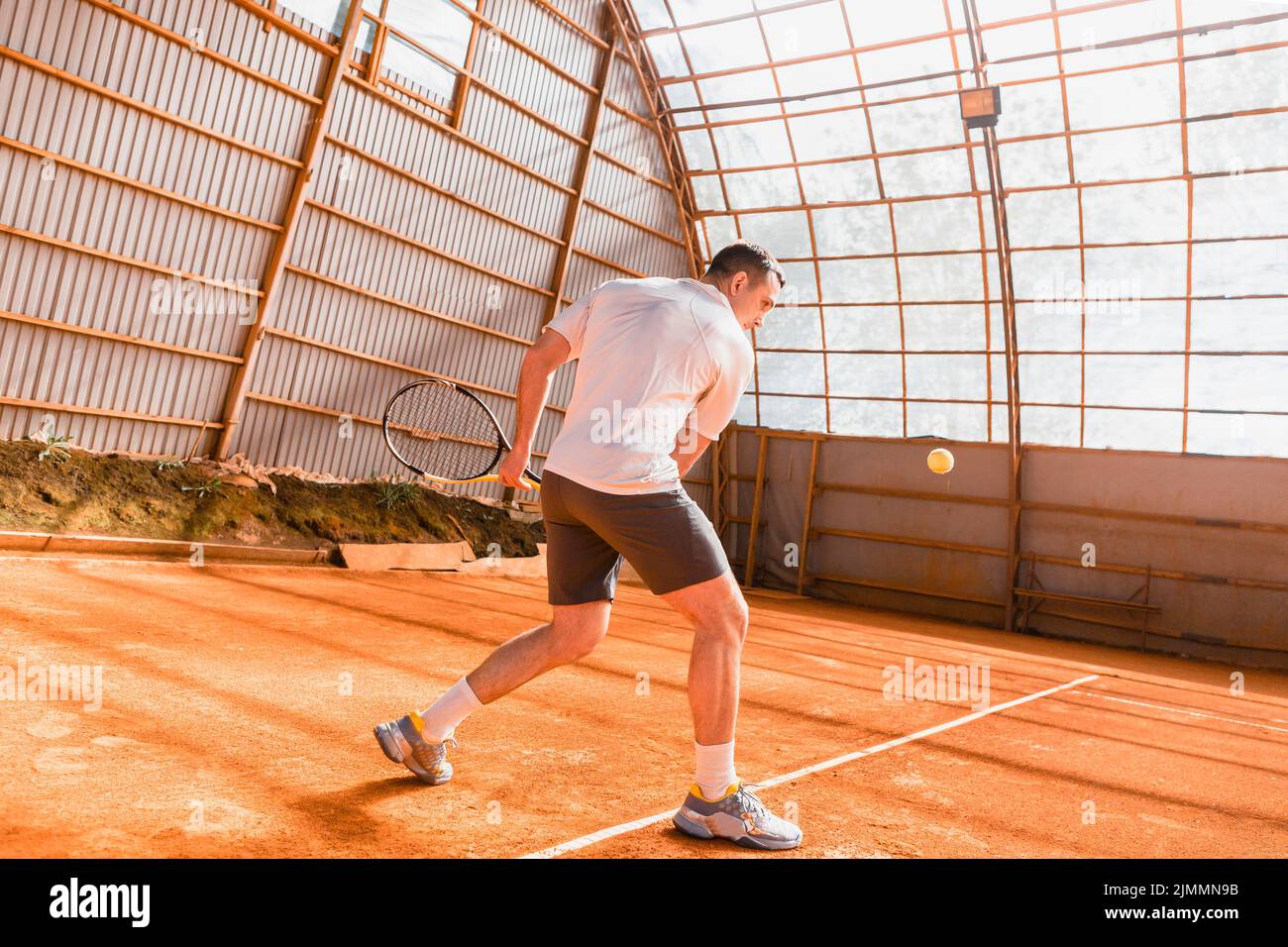 Tennis player swinging racket hi-res stock photography and images - Alamy
