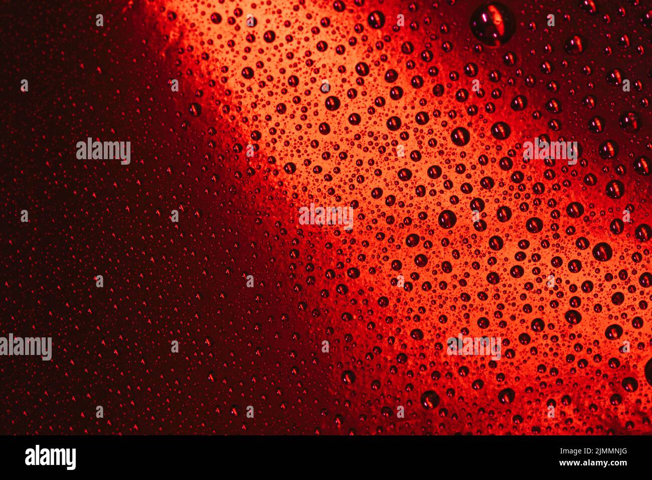 Water drops glass red bright background Stock Photo - Alamy