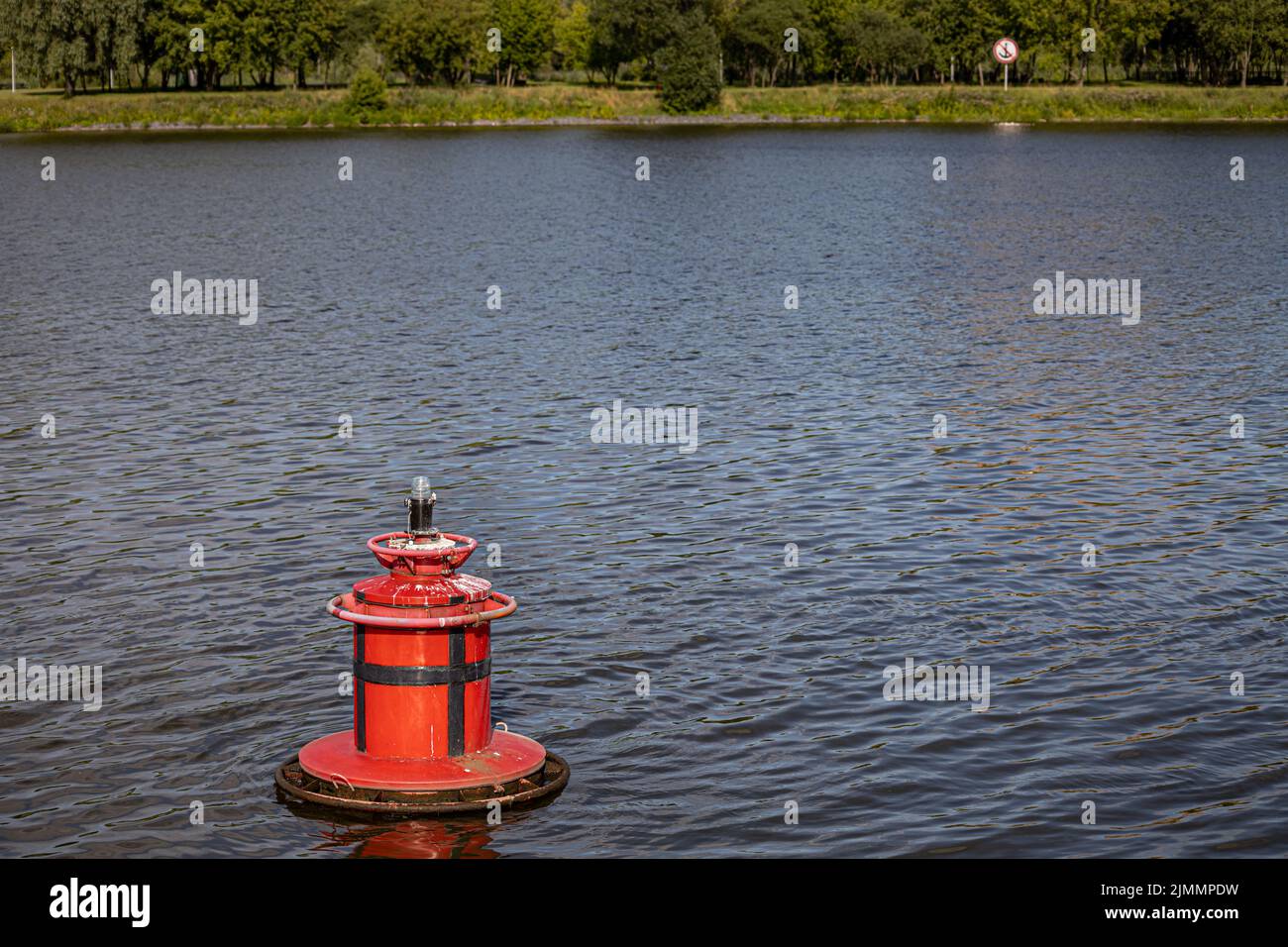 red floating lighthouse on the surface of the water. High quality photo ...