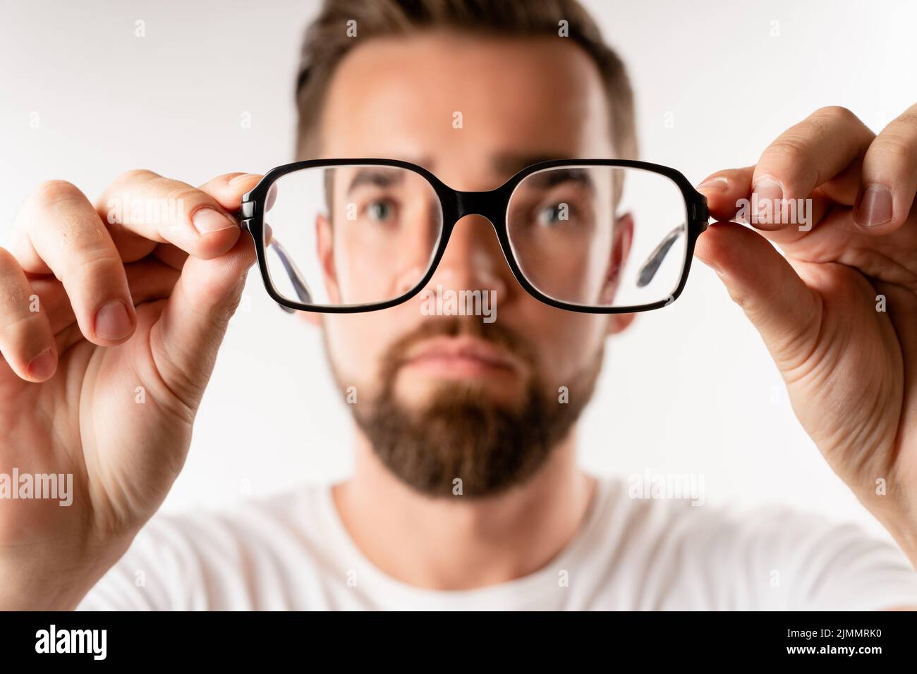 Man holding spectacles hi-res stock photography and images - Alamy