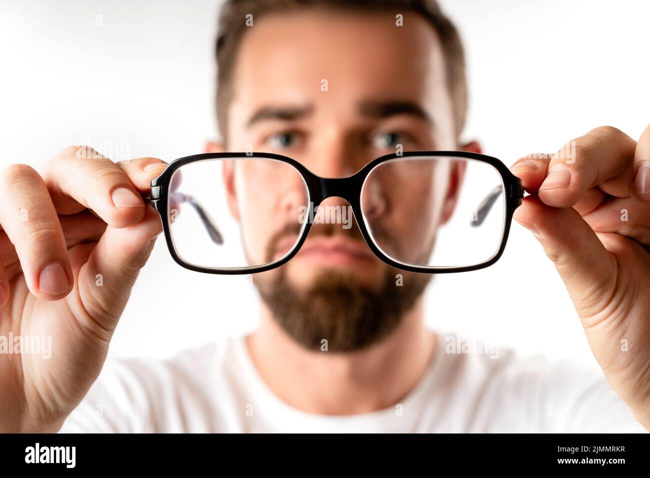 Man holding spectacles hi-res stock photography and images - Alamy