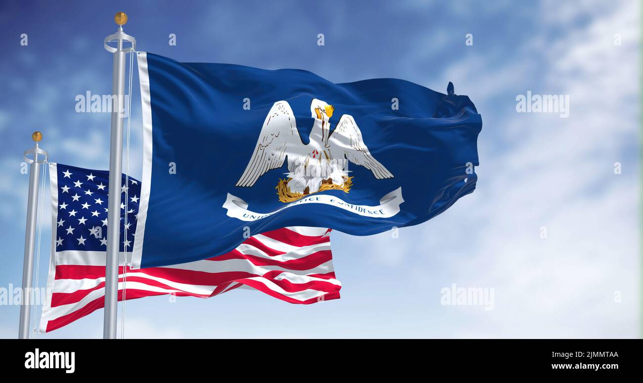 The Louisiana state flag waving along with the national flag of the ...