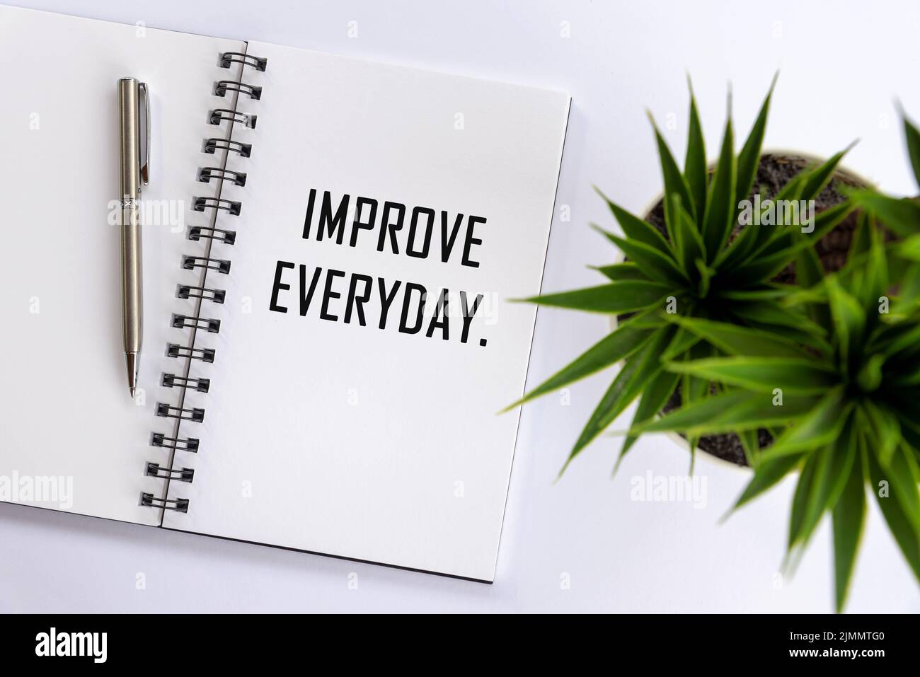 Improve everyday. Self improvement concept with text on a notepaper ...