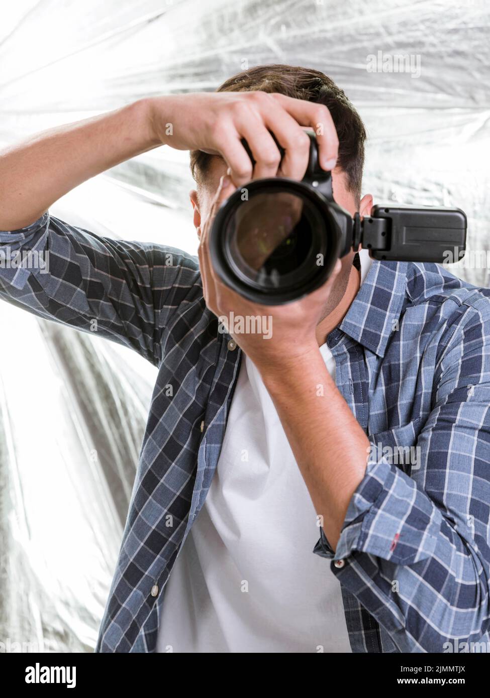 Man taking with professional camera Stock Photo - Alamy
