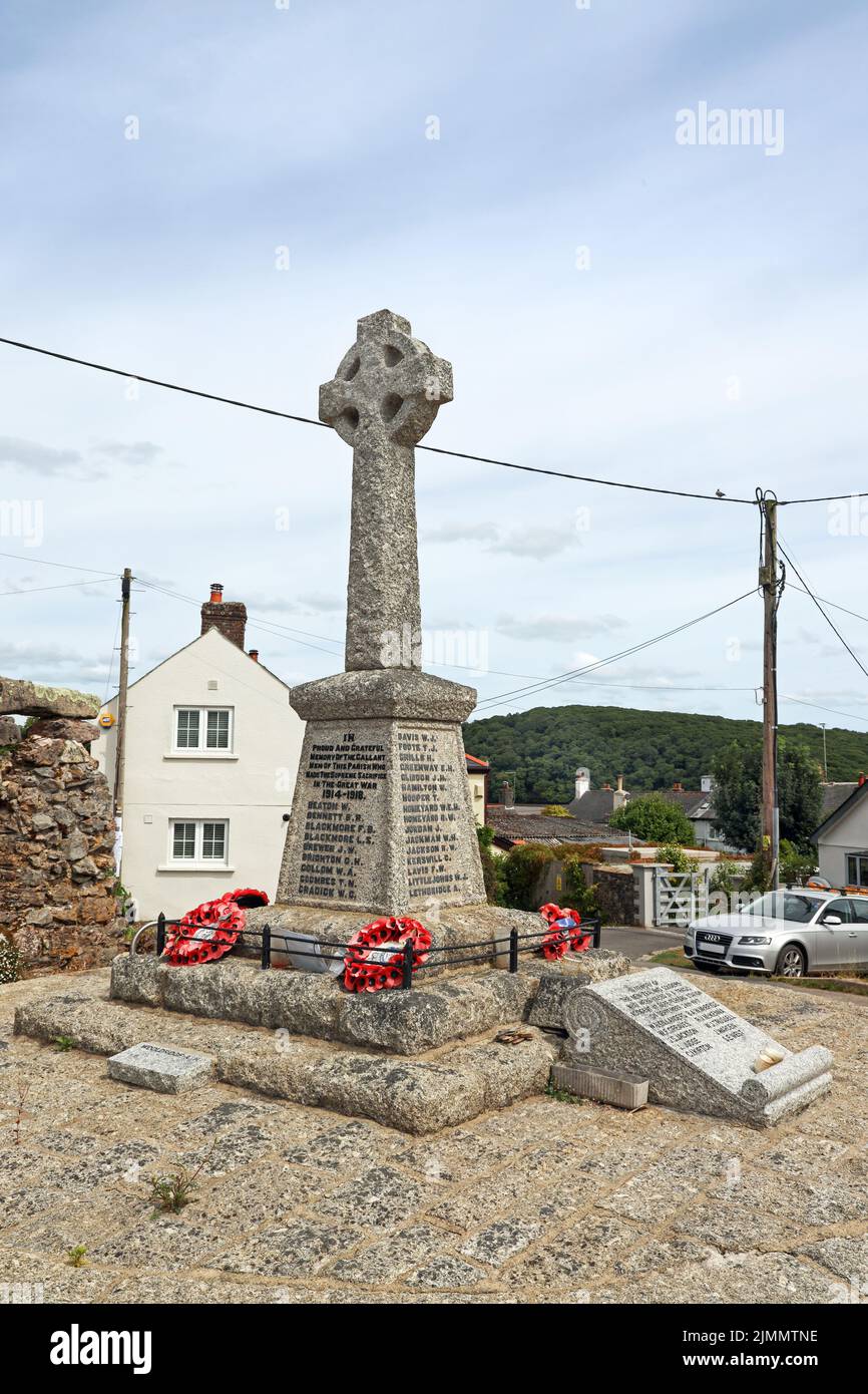 The rough hewn Celtic cross on a plinth, War Memorial in the village of ...