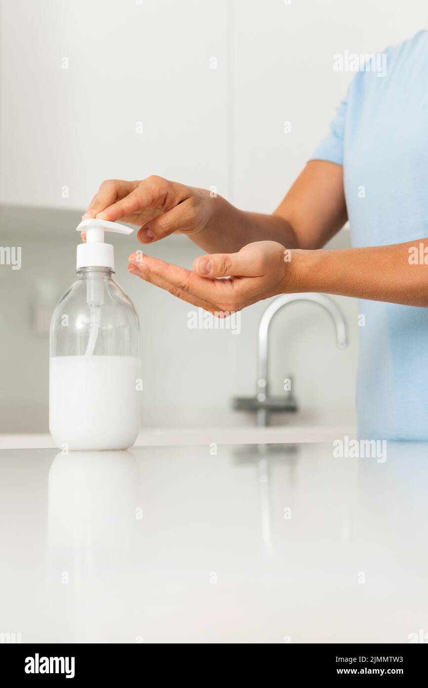 Female hands washing alcohol sanitizer hi-res stock photography and ...