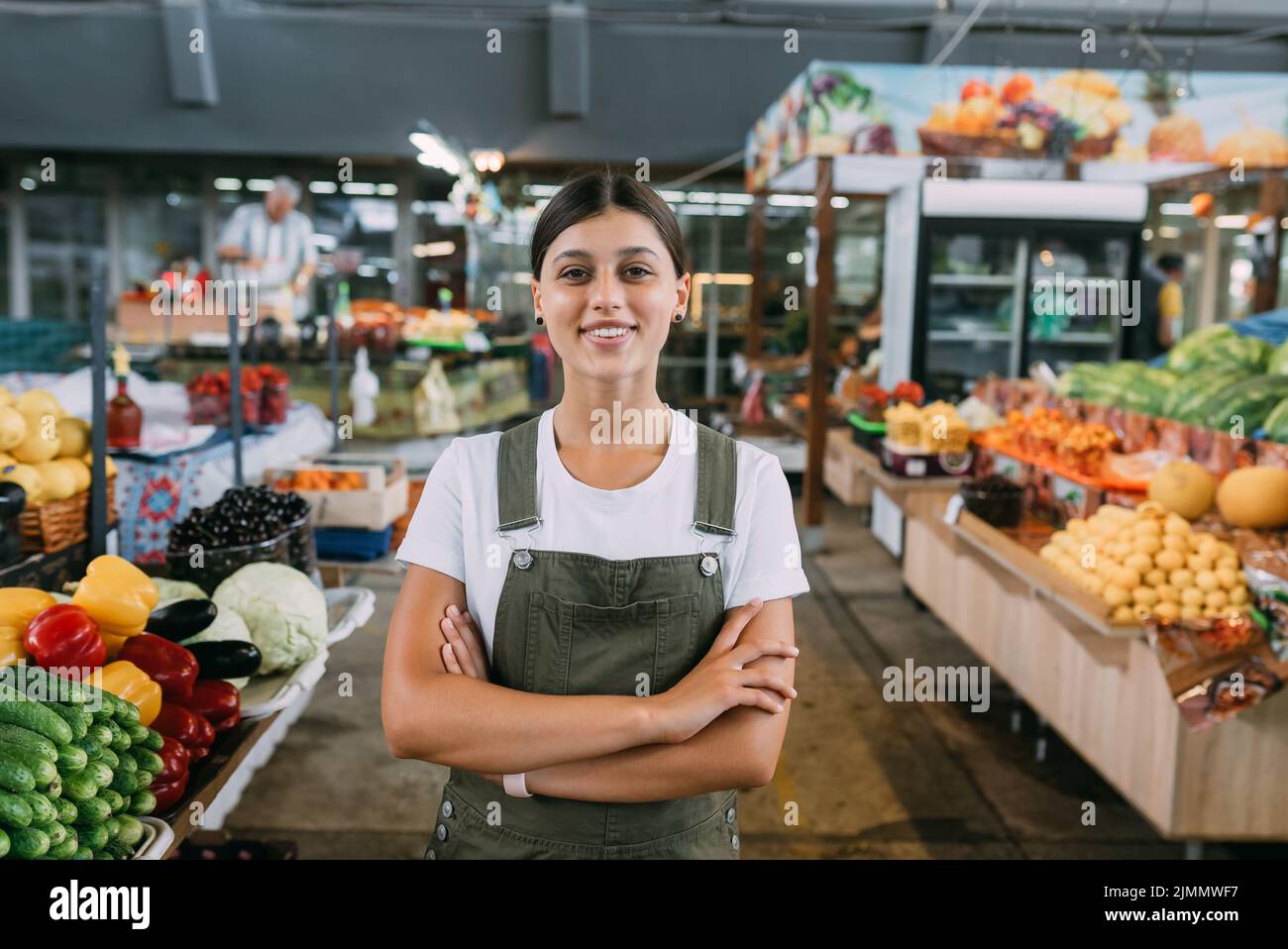 Woman seller of fruit at the market near the counter Stock Photo - Alamy