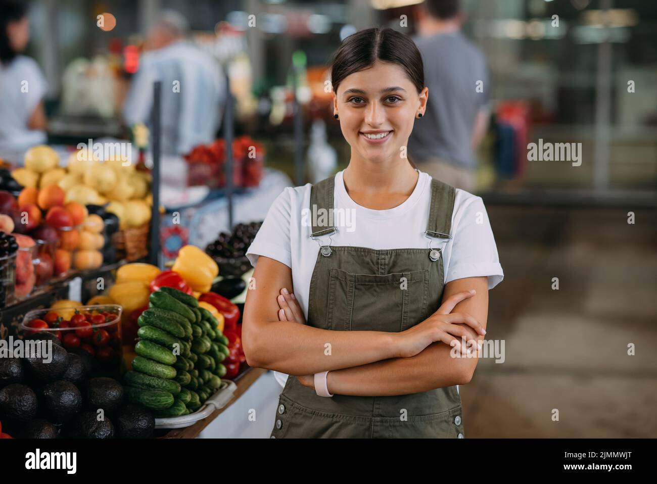 Woman seller of fruit at the market near the counter Stock Photo - Alamy