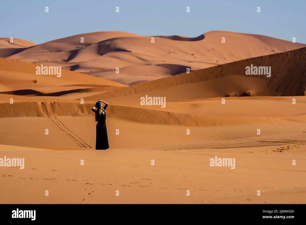 A Beautiful Model Poses In The Sand Dunes In The Great Sahara Desert In ...