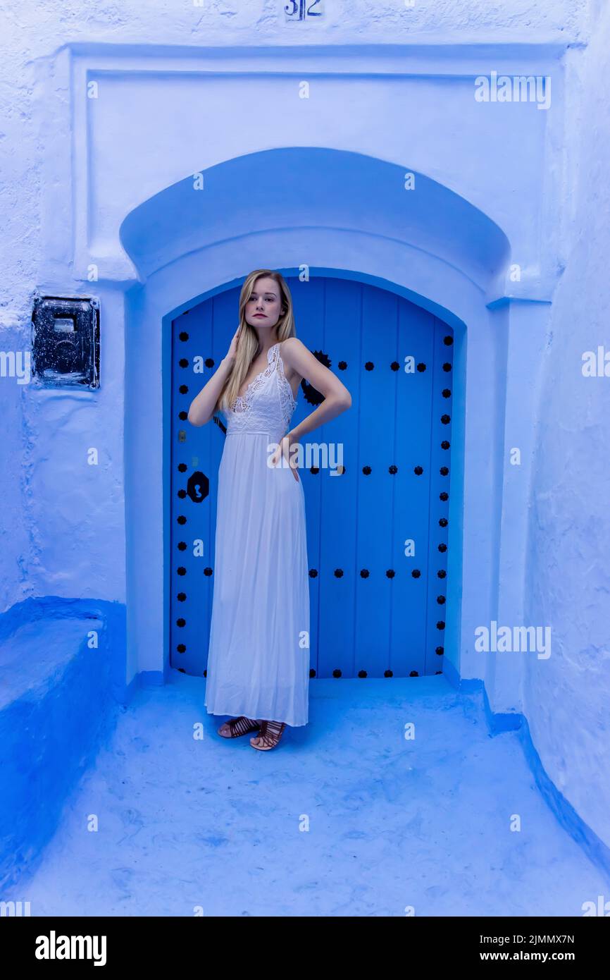 A Model Poses In The Famous City Of Chefchaouen Also Known As The Blue ...
