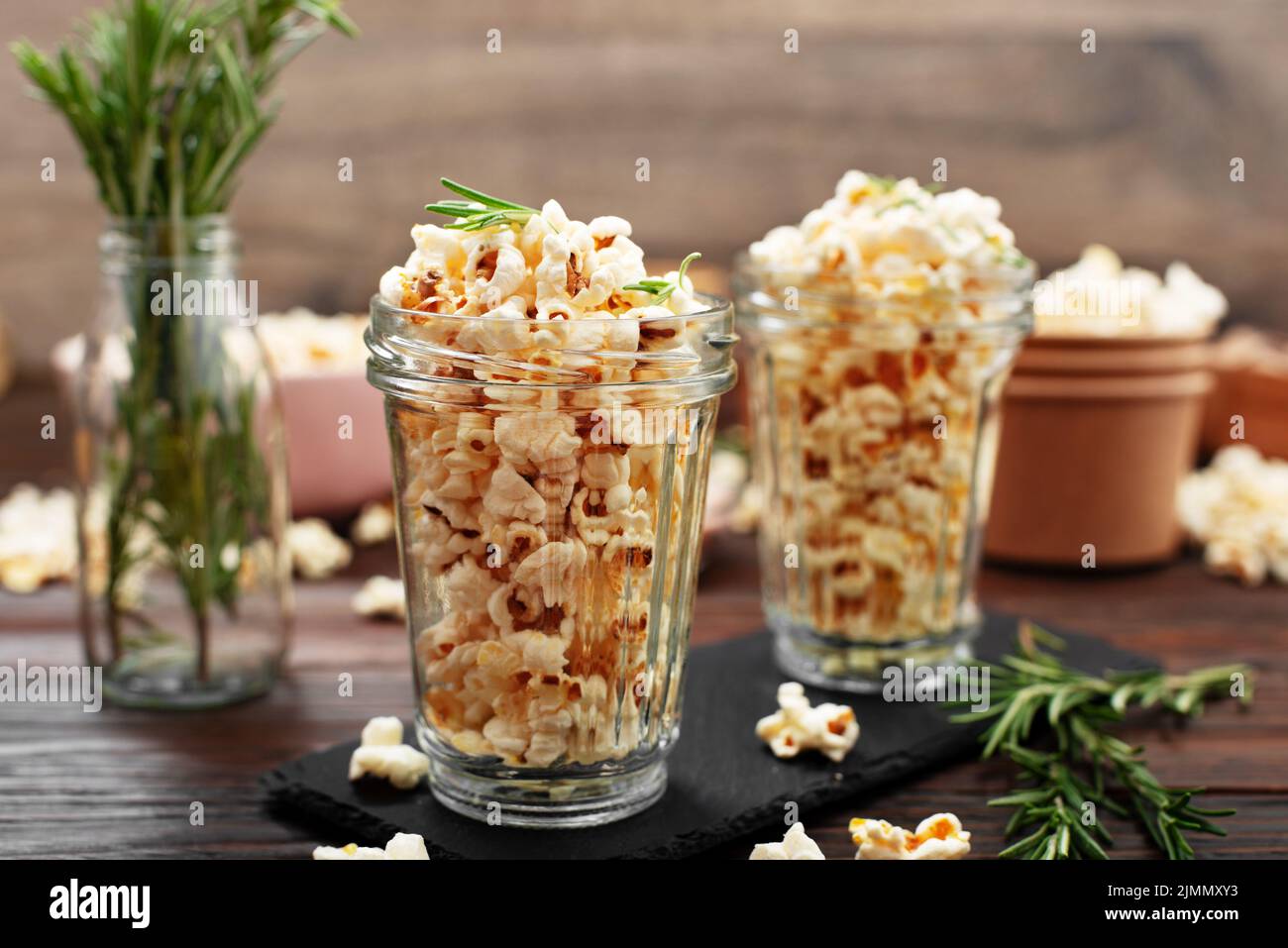 Glasses with popcorn on slate tray on kitchen table Stock Photo - Alamy