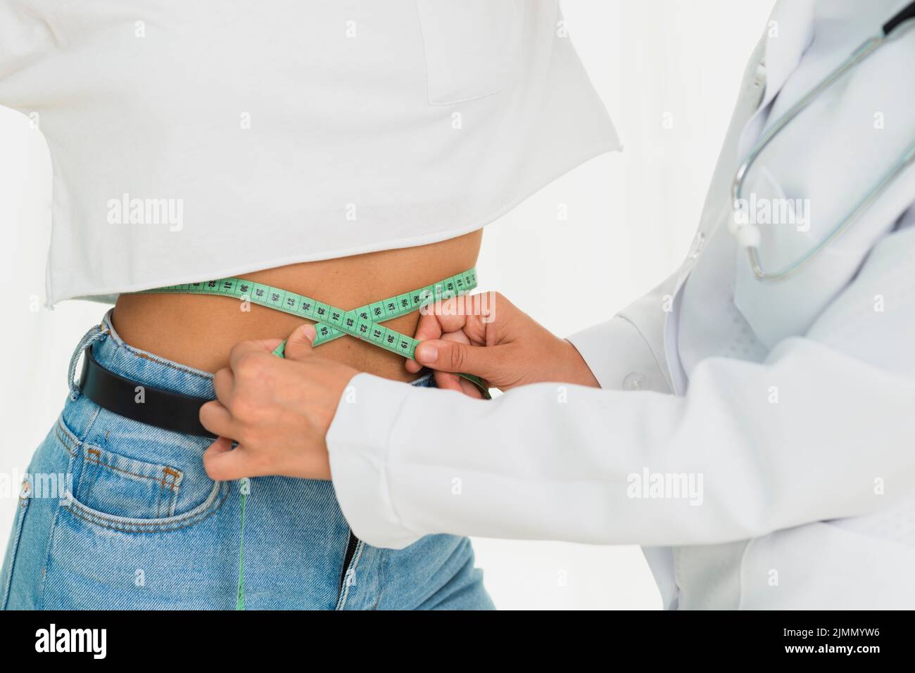 Close up doctor measuring patient Stock Photo - Alamy