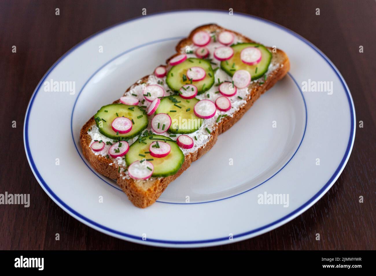 radish, cucumber and soft cheese summer toast on a plate Stock Photo ...