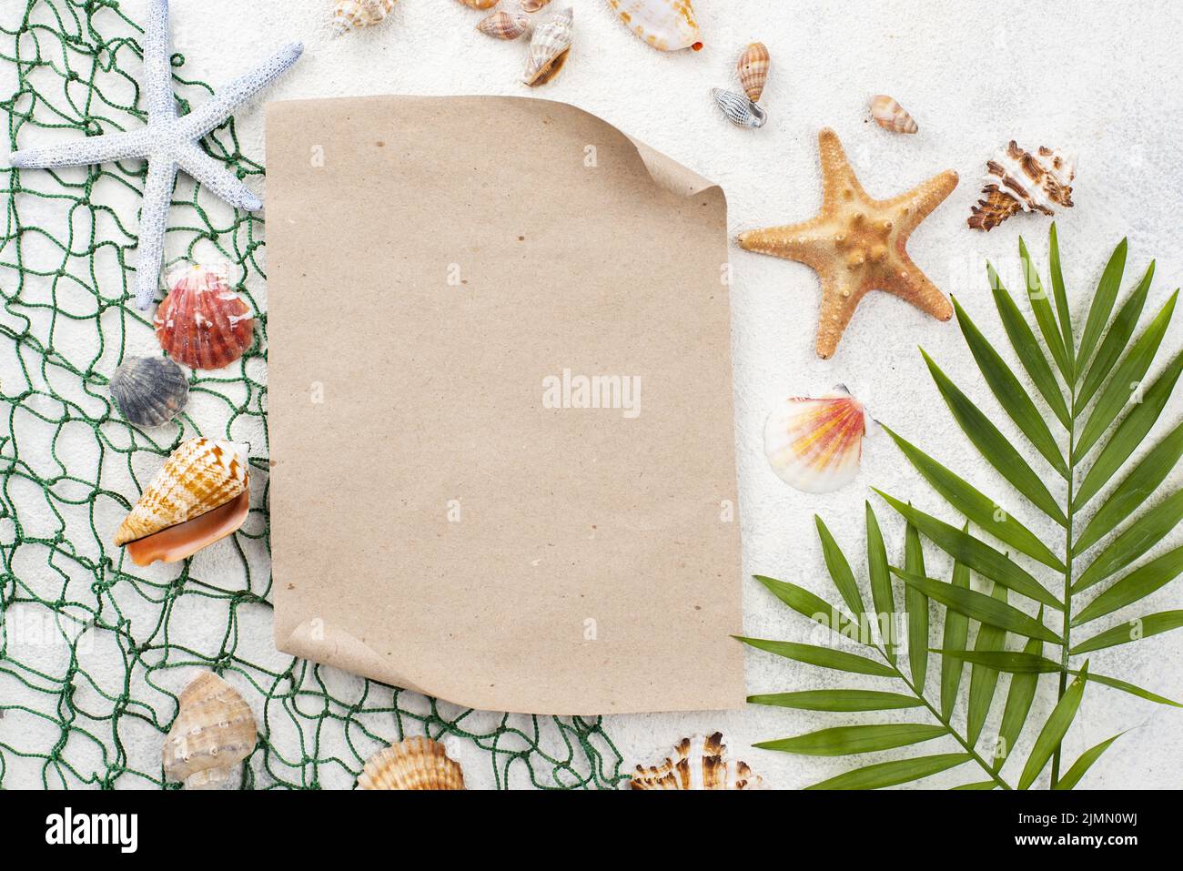 Fish net beside blank paper sheet Stock Photo - Alamy