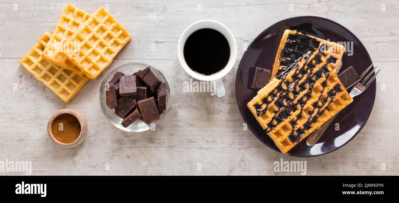 Flat lay plate with chocolate waffles Stock Photo - Alamy
