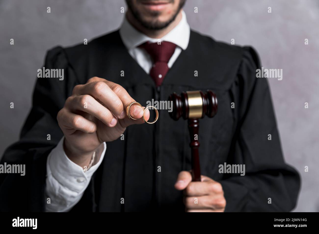 Close up judge with golden rings gavel Stock Photo - Alamy
