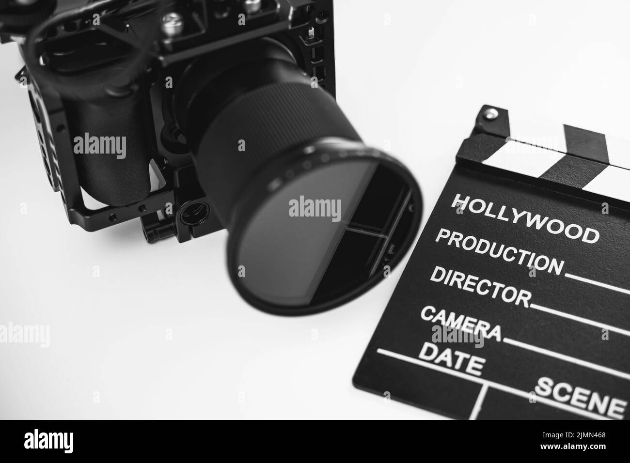 Modern black mirrorless camera rig and clapperboard Stock Photo - Alamy