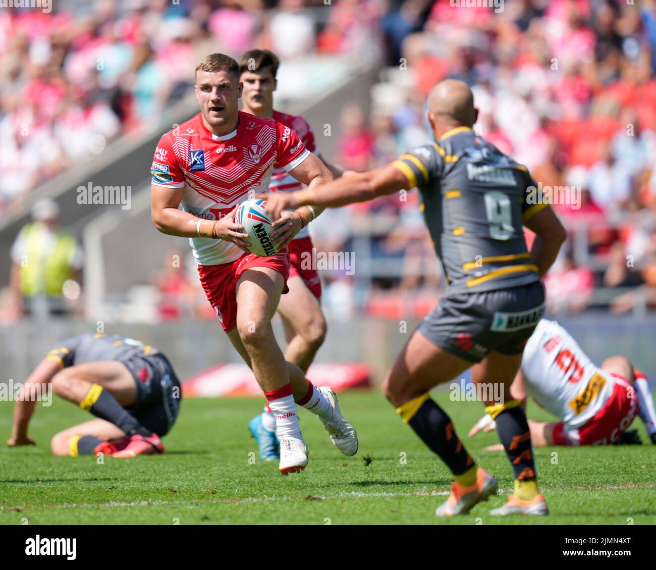 Matty Lees #10 of St Helens runs at Paul McShane #9 of Castleford ...