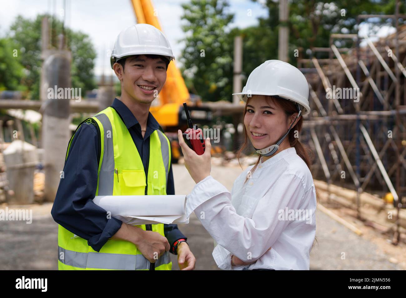 Structural engineer and architect discussing and working with ...