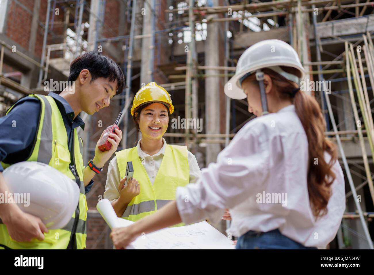 Structural engineer and architect discussing and working with ...