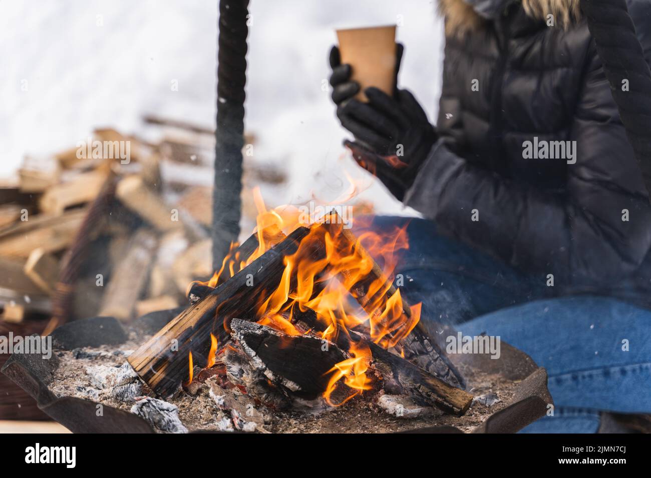 Firewood burning inside the fire-pit during cold winter day Stock Photo ...