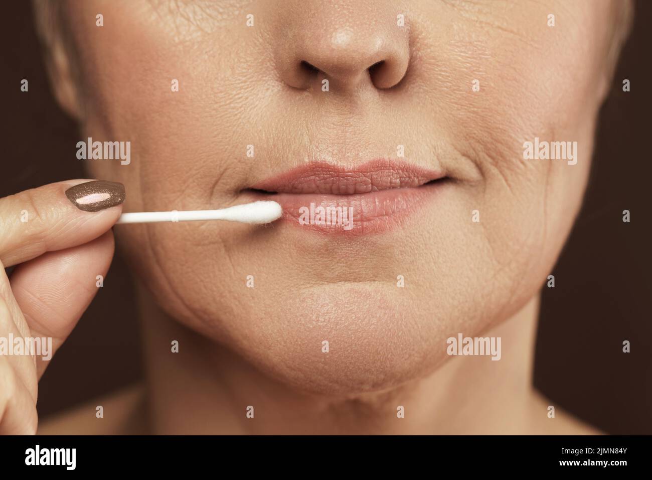 Female face and cotton swab. Hygiene or makeup corrections Stock Photo ...