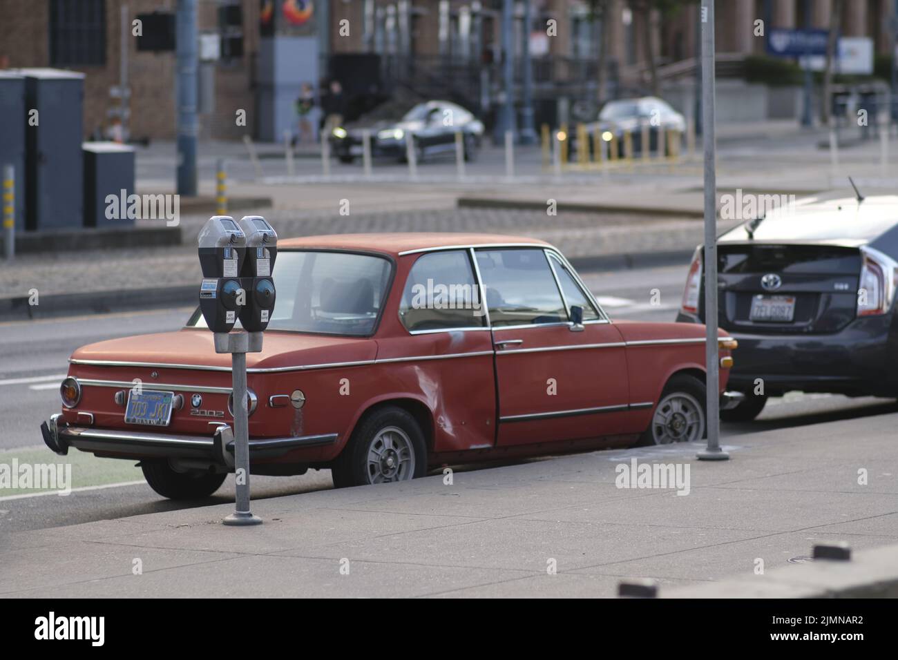 An old red vintage retro BMW 2002 car parked on a street in San ...