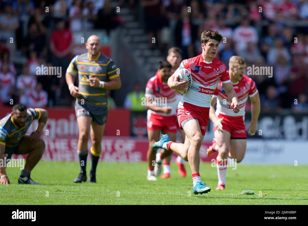 Joe Bennison #27 of St Helens breaks through the Castleford Tigers ...