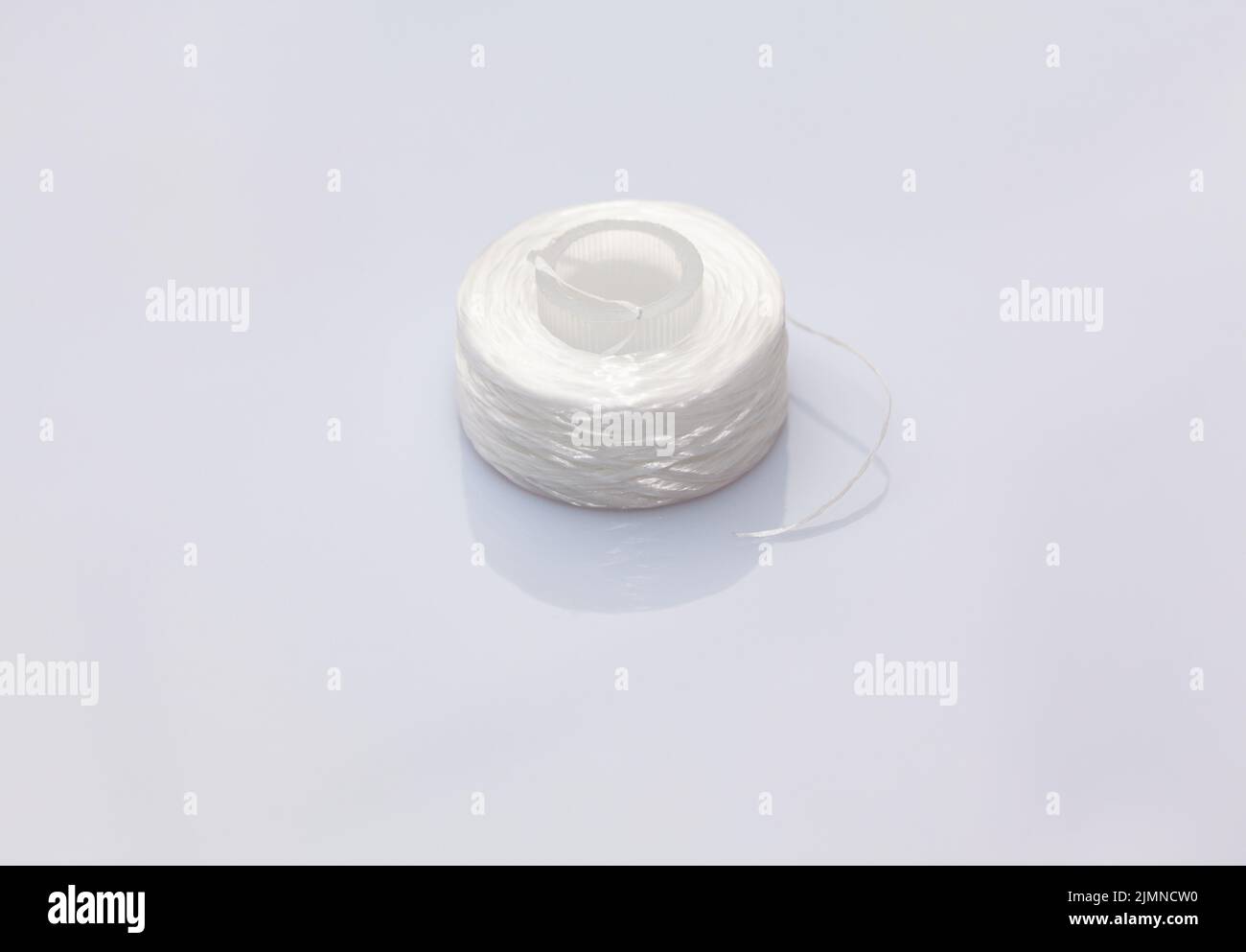 Dental floss at white background . Nylon thread for teeth cleaning ...